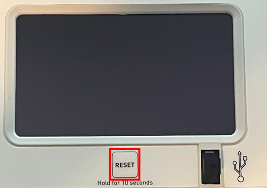 Why is there a “RESET” button on the front bezel of my IntelliCenter?